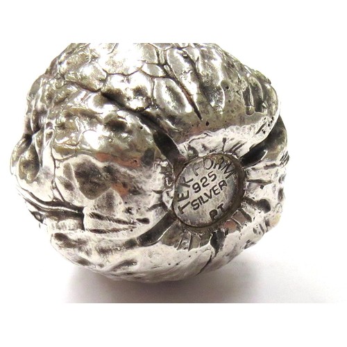 A silver model of a walnut stamped Tekform 925 to base