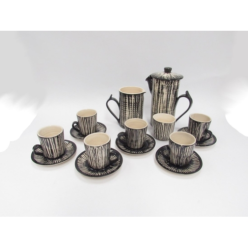 ERIC LEAPER - A Newlyn pottery coffee service, black ground with white ...