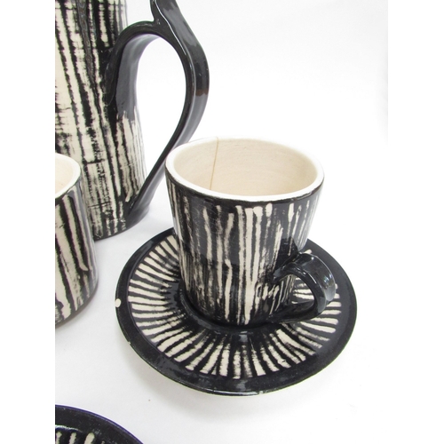 ERIC LEAPER - A Newlyn pottery coffee service, black ground with white ...