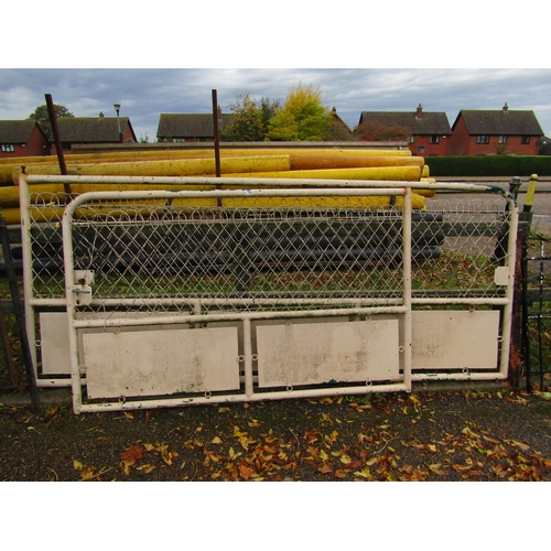 A pair of drive gates with panelled base and wirework screen, one gate ...