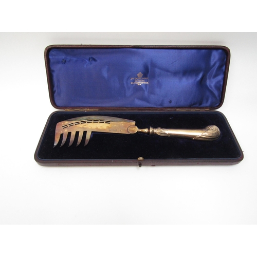 A silver gilt five tooth fish slice, the handle with marks for William ...