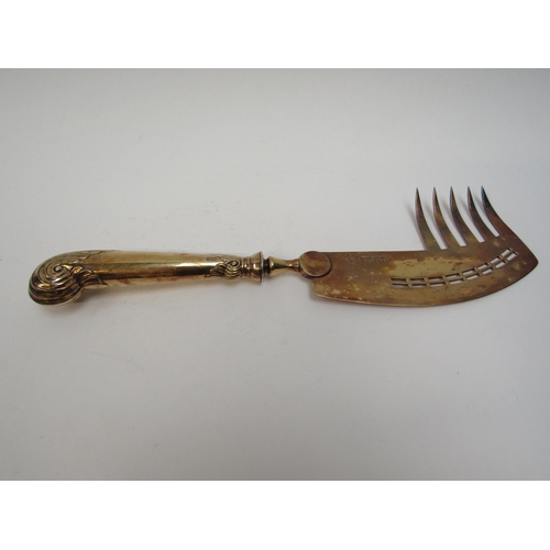 A silver gilt five tooth fish slice, the handle with marks for William ...