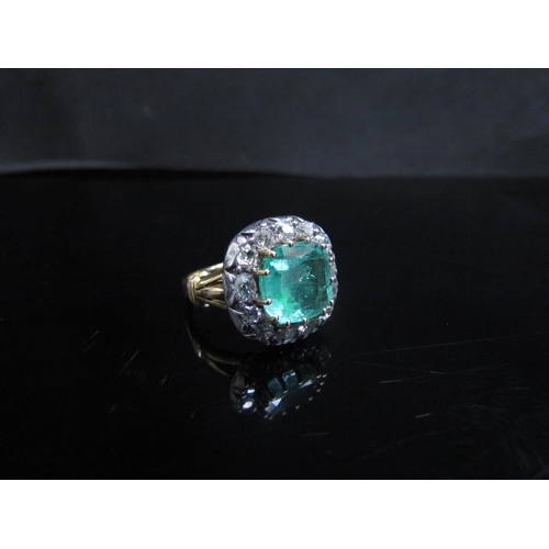 A Georgian emerald and diamond ring, the central emerald 10mm x 10mm ...