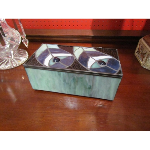 A Tiffany style lead glazed jewellery box with peacock feather lid ...