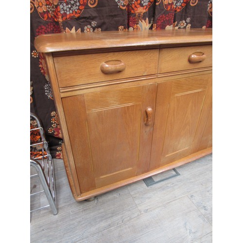 A Priory oak small side cabinet with three cupboard doors and three ...