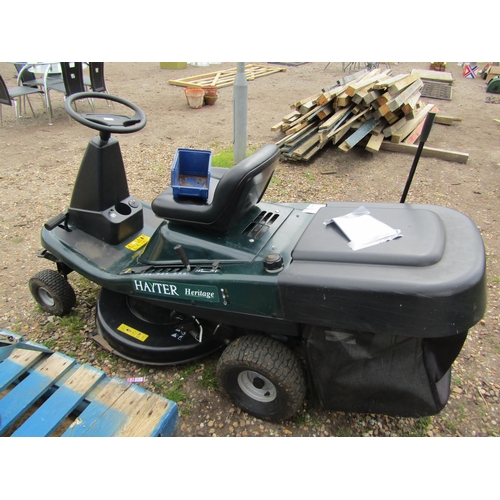 A Hayter Heritage M10/30 ride-on mower with key and instructions