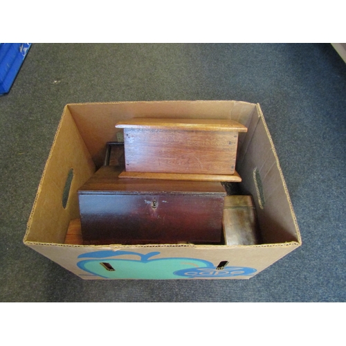 A collection of wooden boxes including carved and sliding examples (7)