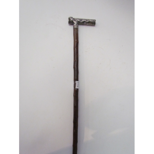 A Chinese white metal handled walking cane, dragon detail