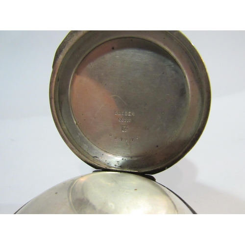 A silver fob watch with engraved detail