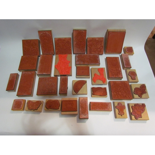 A box of wood and rubber printing blocks, Christmas and flower images
