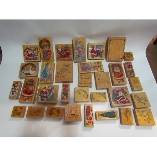 A box of wood and rubber printing blocks, Christmas and flower images