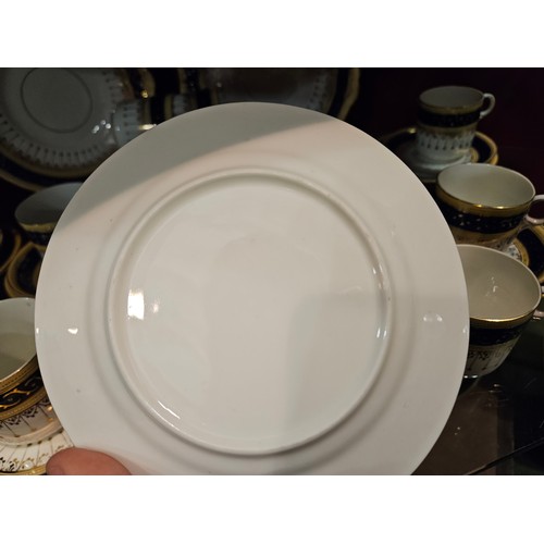 A china tea set, white ground, blue/yellow rims, gilt embellishment ...