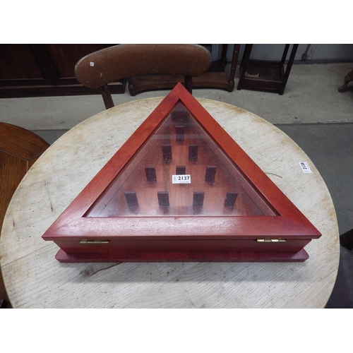 A mahogany triangle display unit
