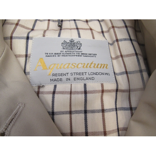 An Aquascutum lady's single breasted rain-mac with belt