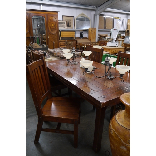 A dining table, drawer missing and four chairs by Zocalo (R) £0