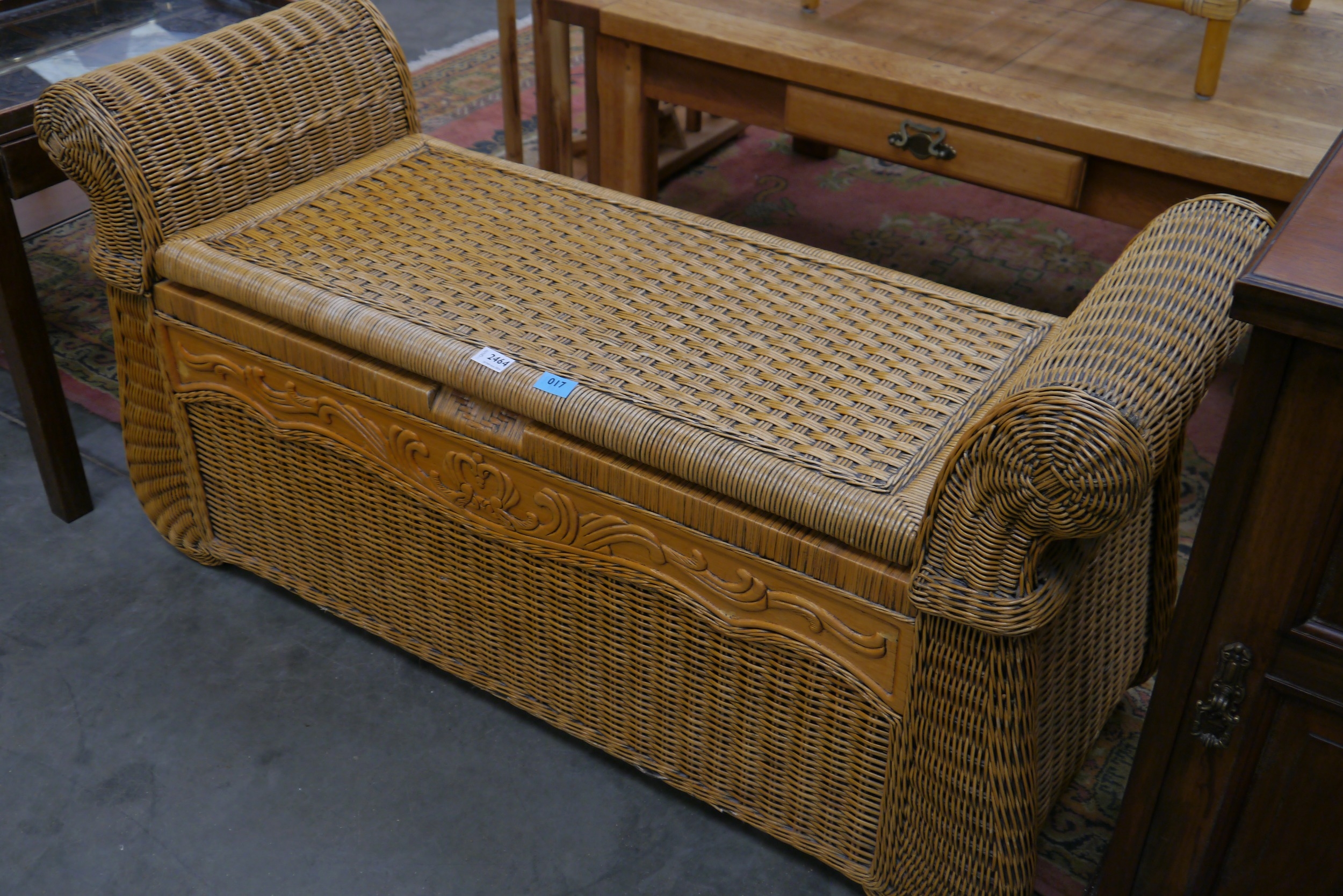 A ratten ottoman window seat