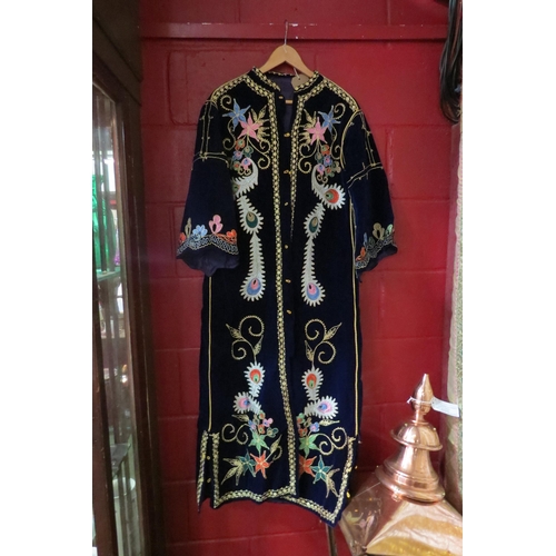 A velvet evening cocktail coat with eleborate embroidery of peacock and ...