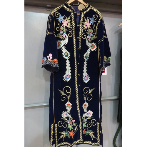 A velvet evening cocktail coat with eleborate embroidery of peacock and ...