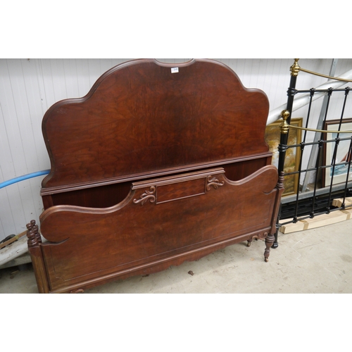 A 20th Century flame mahogany double bed frame, shaped head and foot ...
