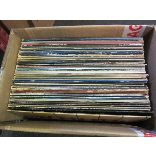 A collection of approximately 50 assorted Rock and Pop vinyl LP records ...