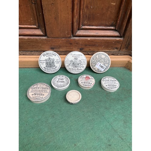 A selection of named paste pot lids including Burgess's (8)