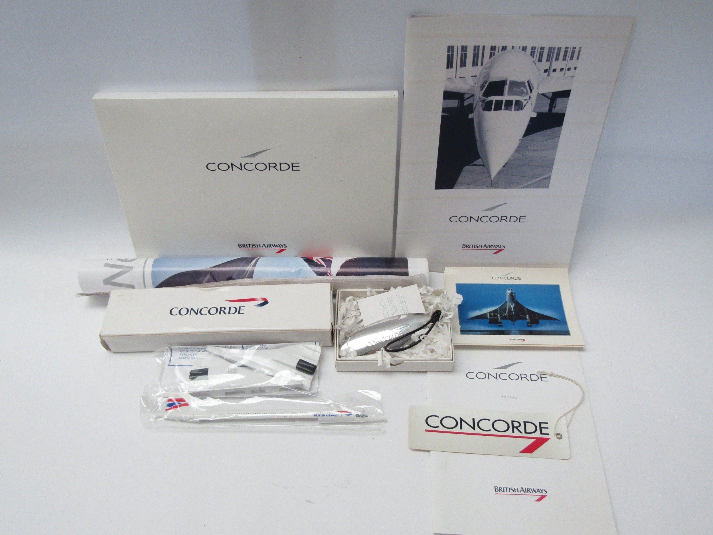 A collection of Concorde memorabilia to include silver spirit tag ...