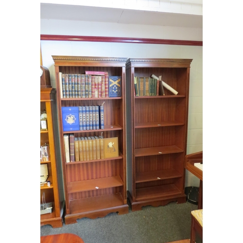 A pair of reproduction mahogany full height bookcases, dentil moulded ...