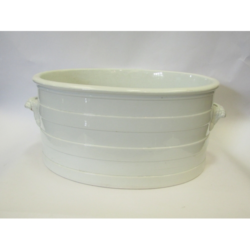A Copeland & Garrett cream glazed pottery foot bath with twin handles ...