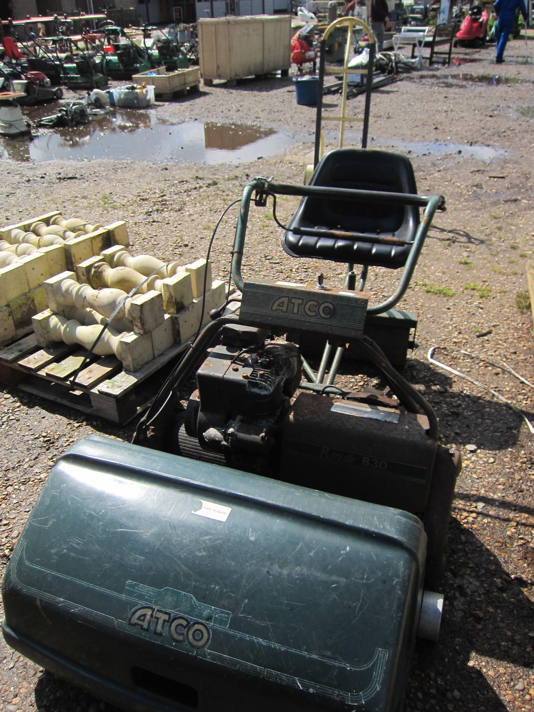 An Atco cylinder mower with collector and roller seat - key in office ...