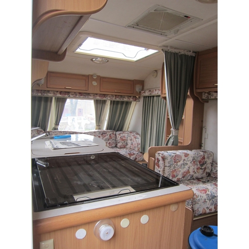 A Compass Rallye four-berth caravan - keys in office