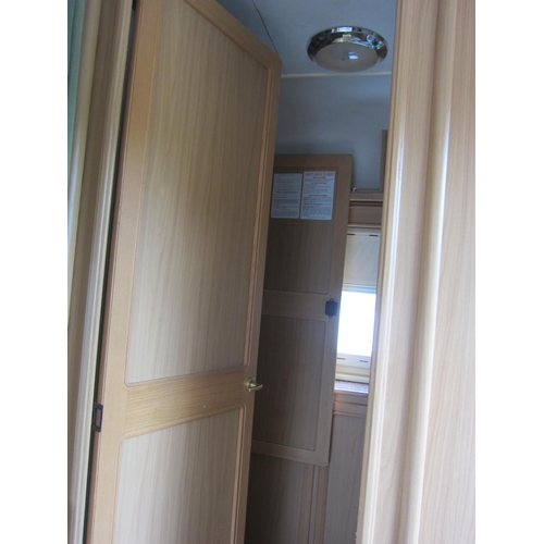 A Compass Rallye four-berth caravan - keys in office