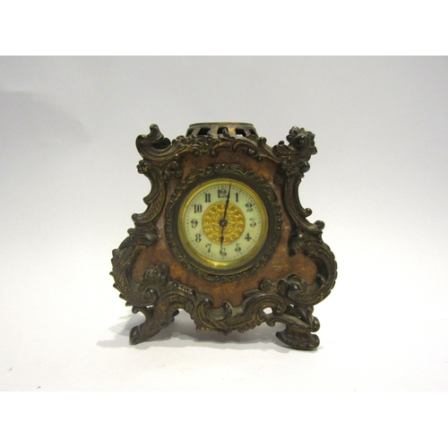 A British United Clock Co. clock with ornate brass decoration and ...
