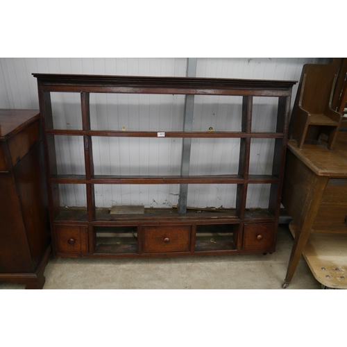 A Georgian oak shelving display wall unit with mahogany inlay