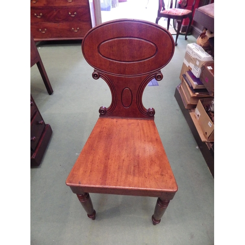 A Regency mahogany carved backrest country house hall chair on turned ...