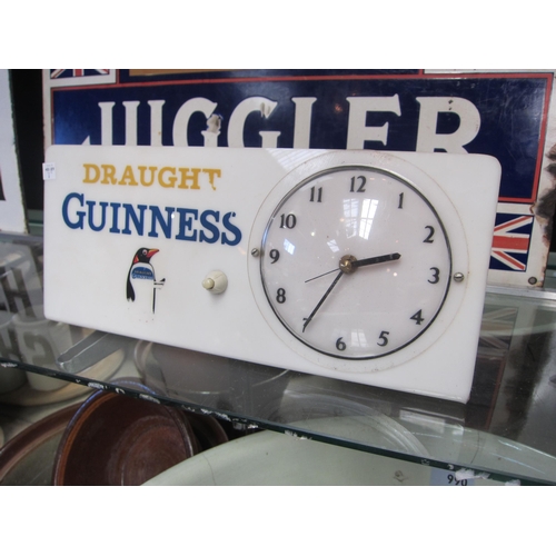 A Guinness promotional clock, electric powered