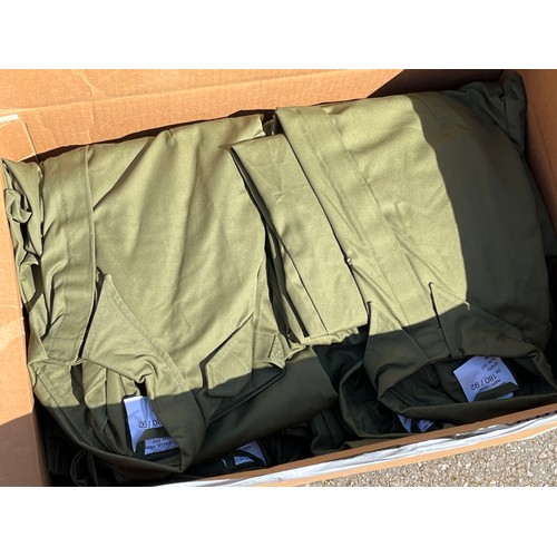 A box of 17 pairs of new US Army coveralls