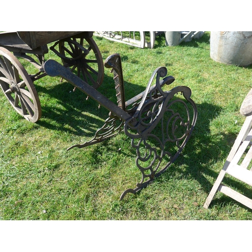 A pair of cast iron rocking chair ends