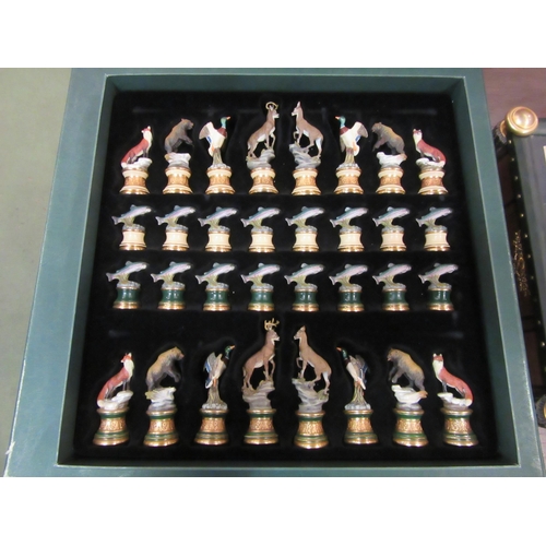 A Franklin Mint 'Sportsman Trophy' chess set, boxed, together with a ...