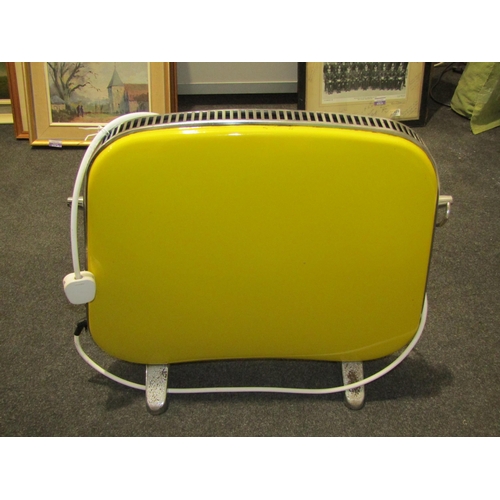 A 1970's blue and yellow electric heater