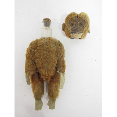A Schuco mohair monkey scent bottle with felt ears, feet and hands ...