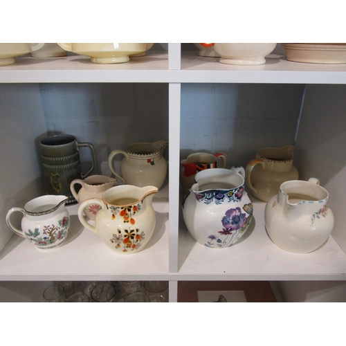 A group of nine studio pottery jugs of various sizes to include ...