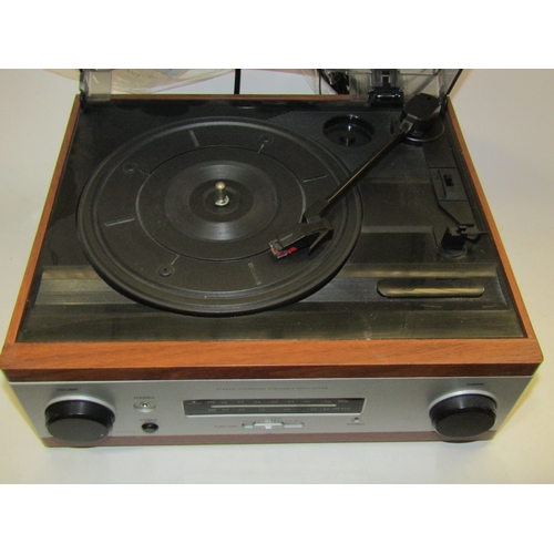 A Steepletone record player with manual and a box of 45's including ...