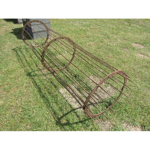 A wrought iron tree guard, approx 182cm tall x 49cm diameter