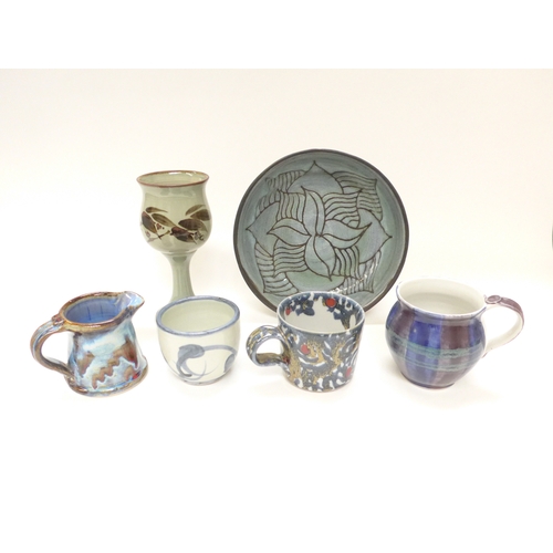 A collection of studio pottery including Dartington, J.S Stuart etc ...