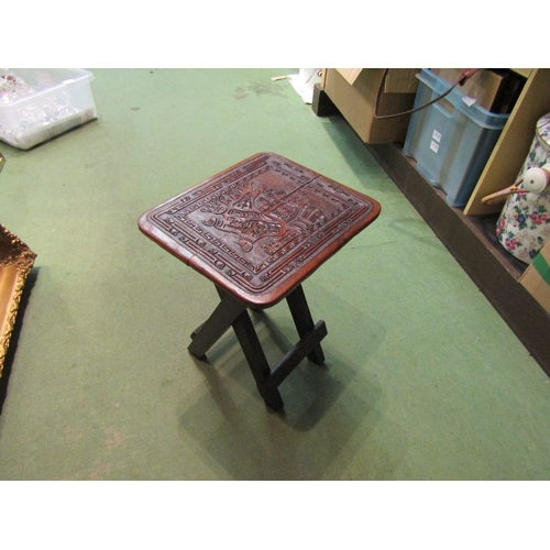 A Peruvian embossed leather top Mohena wood folding table/stool