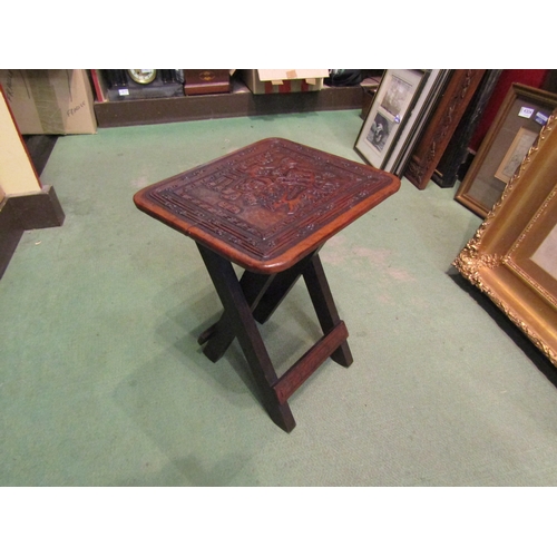 A Peruvian embossed leather top Mohena wood folding table/stool