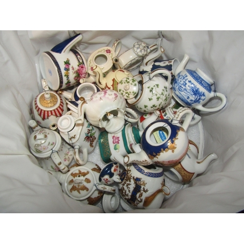 A collection of limited edition miniature teapots