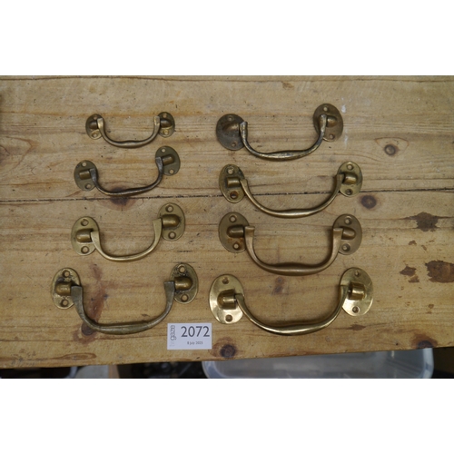 Eight assorted Georgian brass swan neck handles
