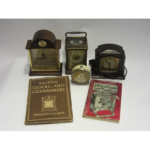 A box containing four clocks including a carriage clock and Smiths in ...