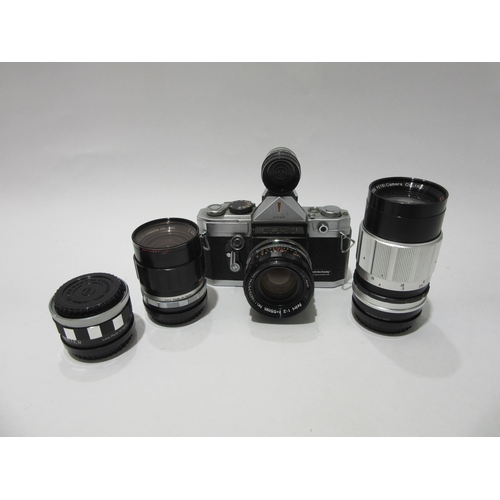 A Petri Flex V SLR film camera with a Petri f/2 55mm lens, a Petri f/2. ...
